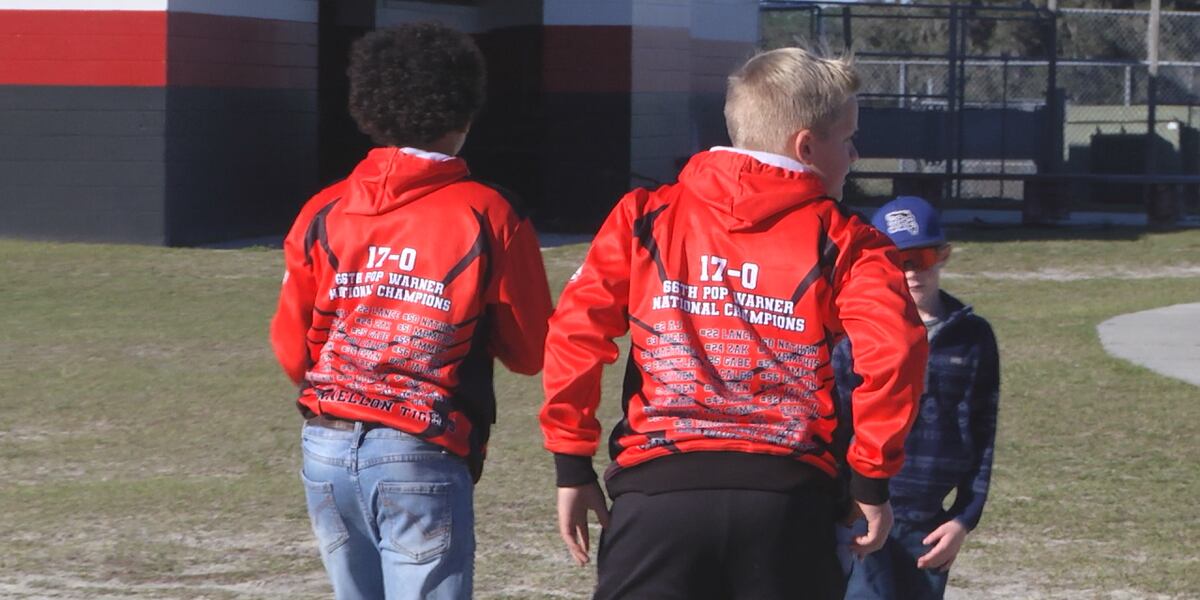 The U10 Dunnellon Tigers celebrate their Pop Warner Championship title The U10 Dunnellon Tigers celebrate their Pop Warner Championship title